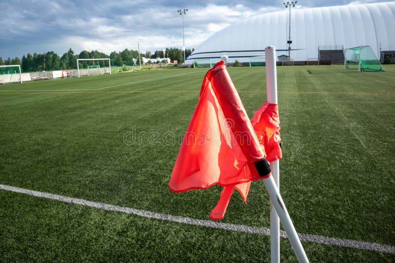 Red Flags on a Green Sports Field Stock Photo - Image of flag, symbol ...