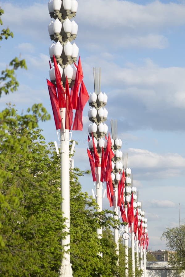 Red flags on lampposts stock image. Image of blue, flying - 146857287