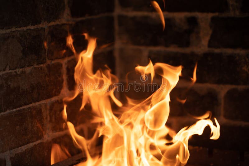 Flames in a Stone Fireplace Stock Image - Image of smoke, stone: 324587501