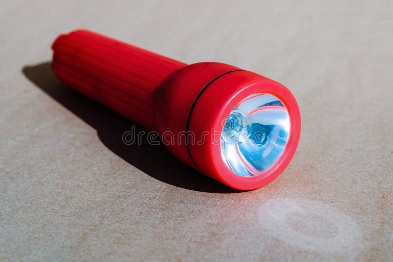 Red Flashlight on a Cardboard Background Stock Image - Image of white ...