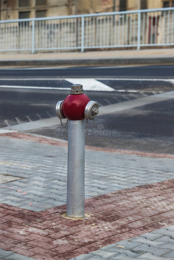 Red Floor Hydrant on the Water. a Hydrant is Installed on the Sidewalk ...
