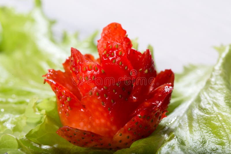 Red Flower from Strawberry on Fresh Greens Stock Photo - Image of ...
