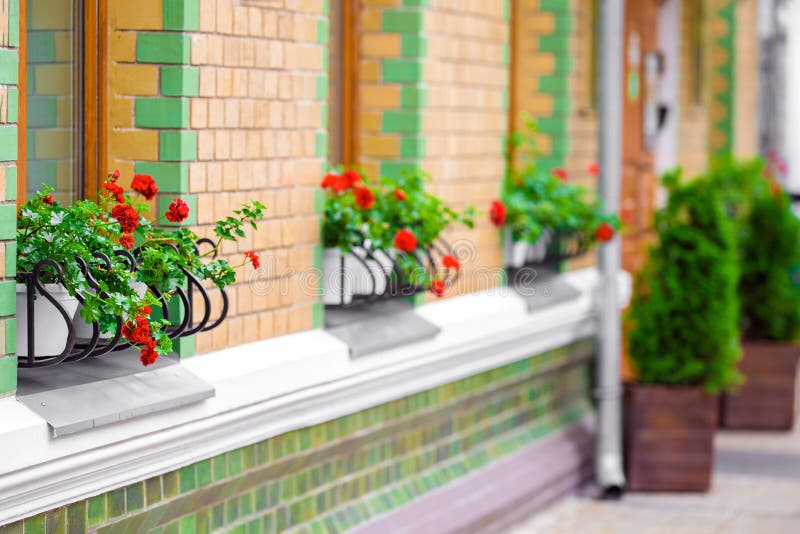Red flowers on the balcony stock image. Image of house - 124322475