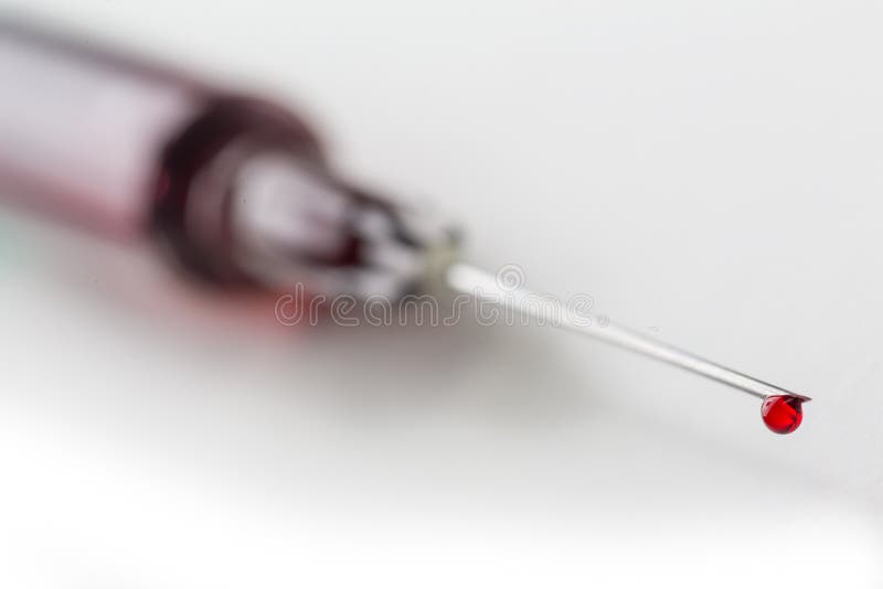 Red Fluid Coming Out of a Syrenge Injection Needle Stock Image - Image ...