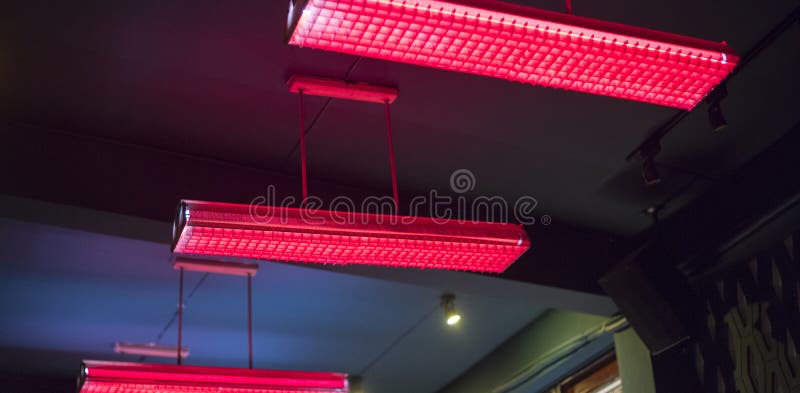Red Fluorescent Lamp Hanging from the Ceiling Stock Photo - Image of ...