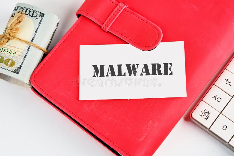 A Red Folder Holds a Card Labeled Malware Next To a Stack of Cash and a ...