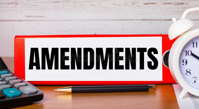 Red Folder for Papers with the Text AMENDMENTS, White Alarm Clock ...