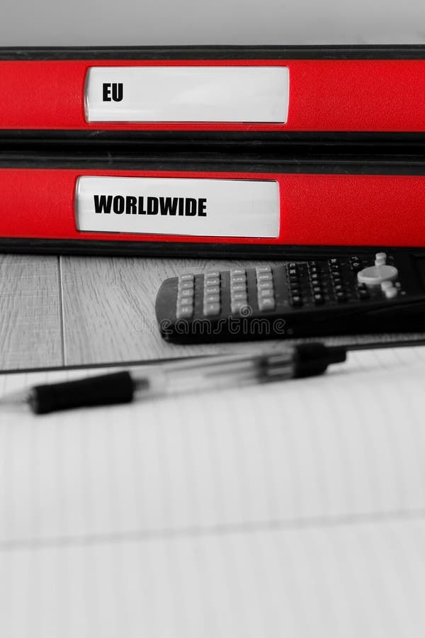 Red Folders with EU and Worldwide Written on the Label on a Desk Stock ...