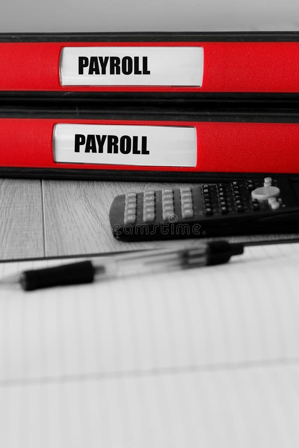 Red Folders with Payroll Written on the Label on a Desk Stock Image ...
