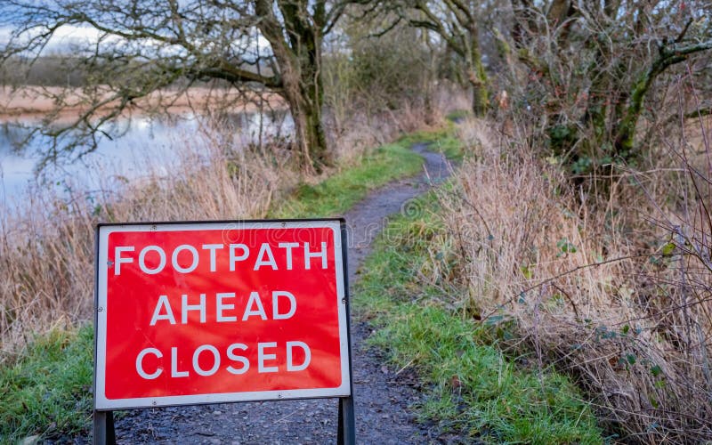 Red Footpath Ahead Closed Warning Sign on a Countryside Trail Stock ...