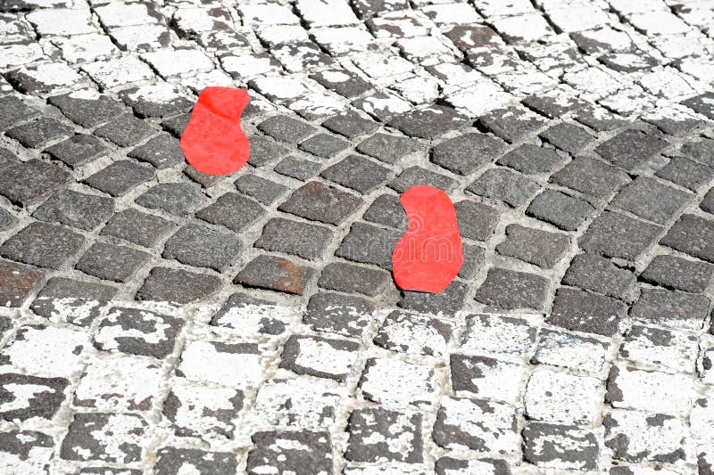Red footsteps in town stock photo. Image of crosswalk - 77341092