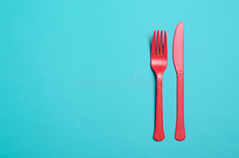 Red Fork and Knife on Bright Blue Background, Single Use Cutlery Stock ...