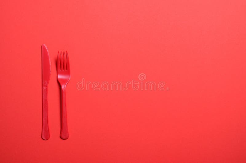 Red Fork and Knife on Bright Orange Background, Single Use Cutlery ...