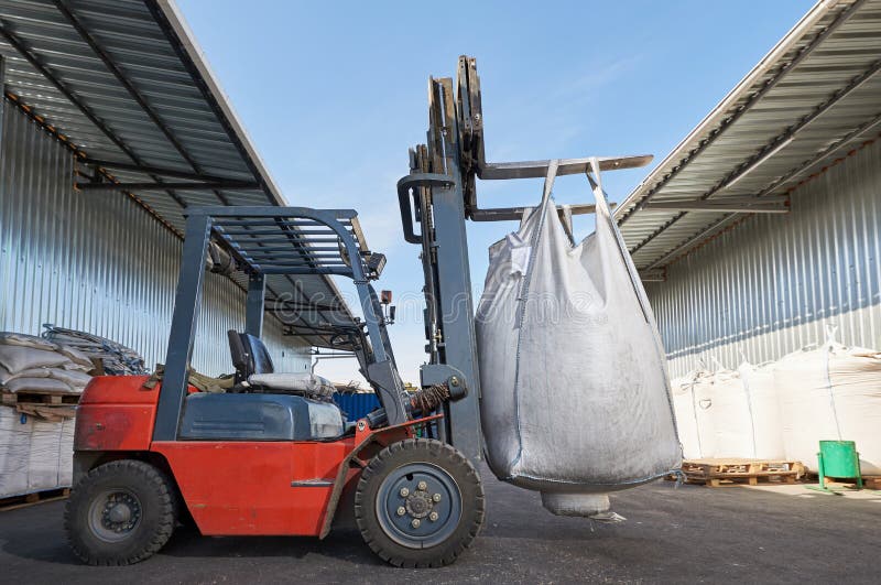Red Forklift Lifts Pallet with Heavy Bags Stock Photo - Image of ...
