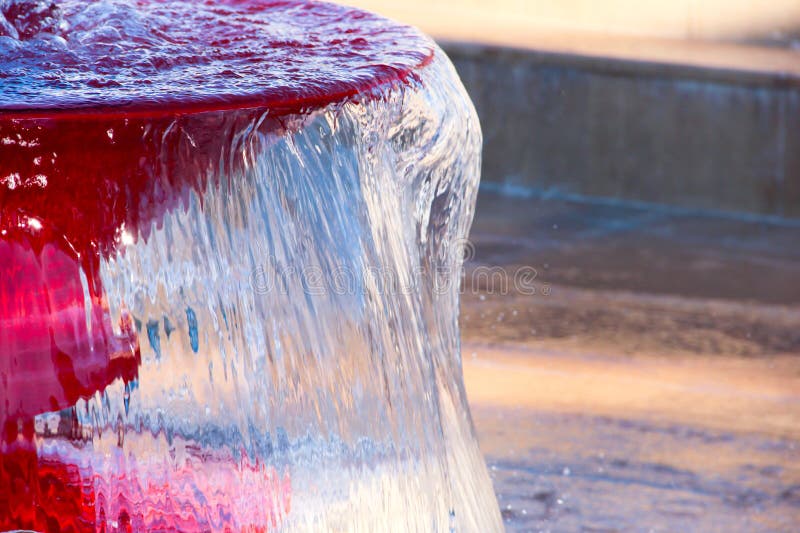 Red Fountain on a Light Background. Water Stock Photo - Image of ...