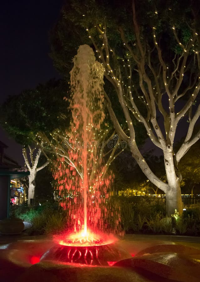 Red Fountain at Night stock photo. Image of explosion - 185258746