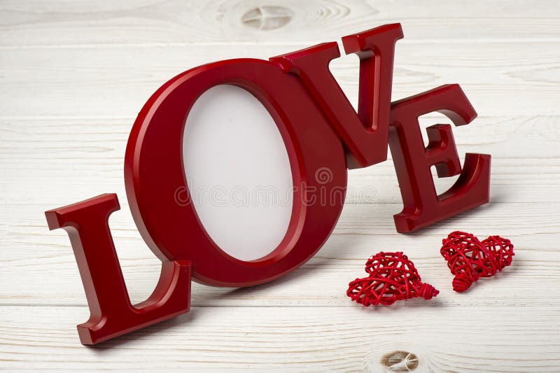 Red Frame for Pictures Love on the Wooden Background. Stock Photo ...
