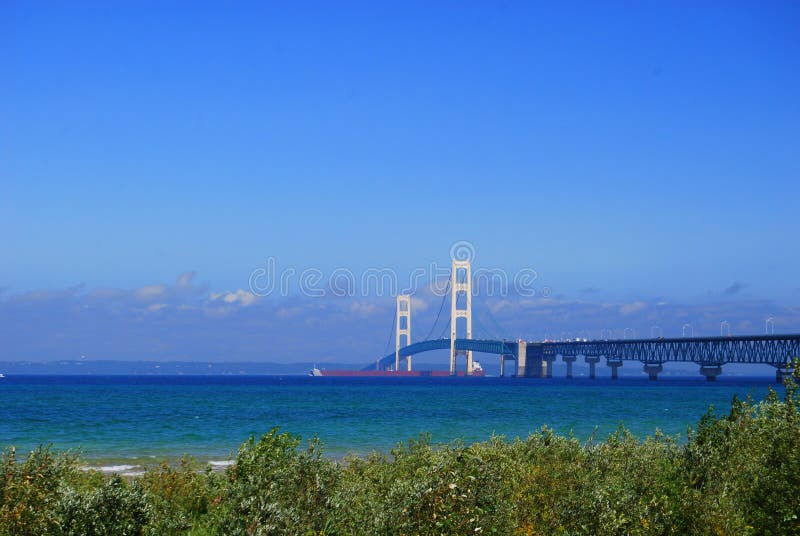 Red Freighter Under the Mighty Mackinac Bridge Stock Image - Image of ...