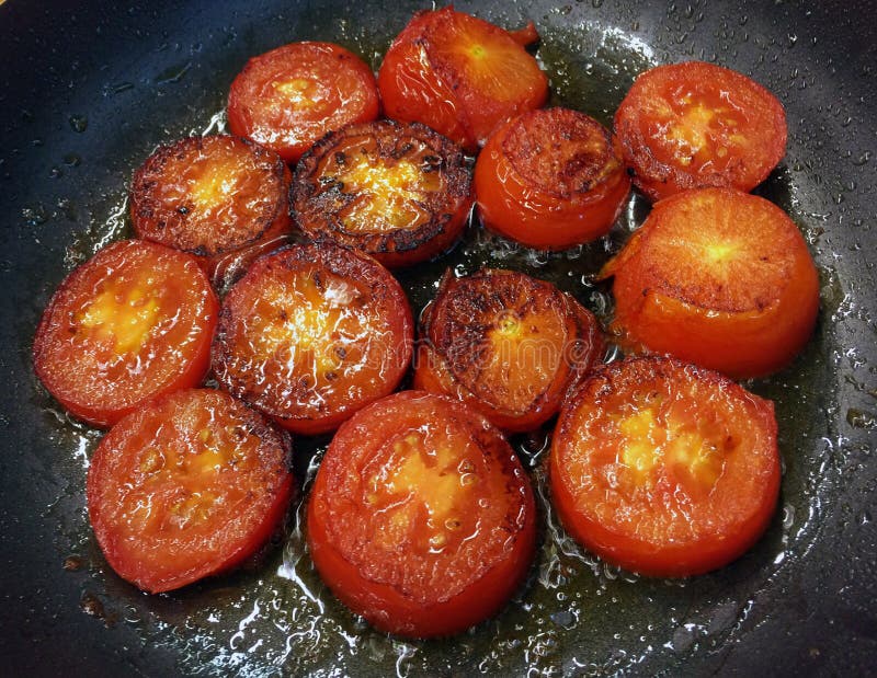 Red fried tomatoes stock photo. Image of cooking, table - 79863998