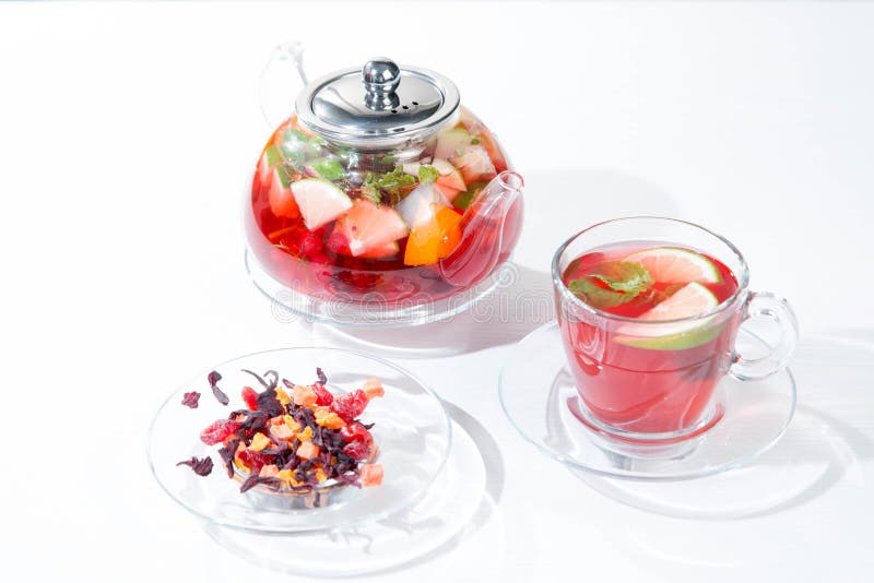 Red Fruit and Berry Tea with Raspberries in a Glass Teapot with Mint on ...