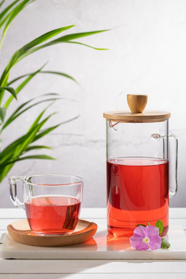 Red Fruit Infusion in Crystal Glass and Pitcher on Wooden Base ...