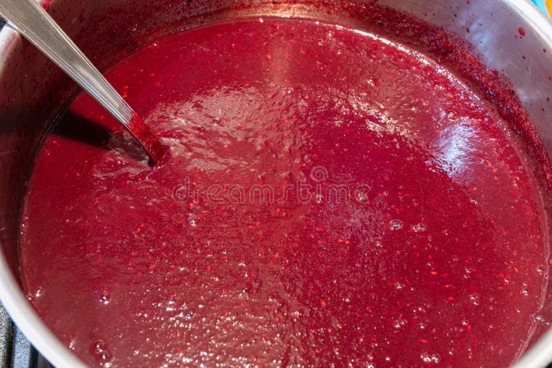 Red fruit jam being cooked stock image. Image of taste - 196046905