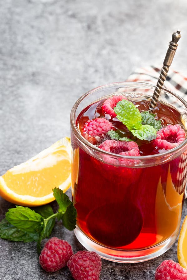 Red Fruit Tea with Raspberry and Orange on Gray Table Stock Photo ...