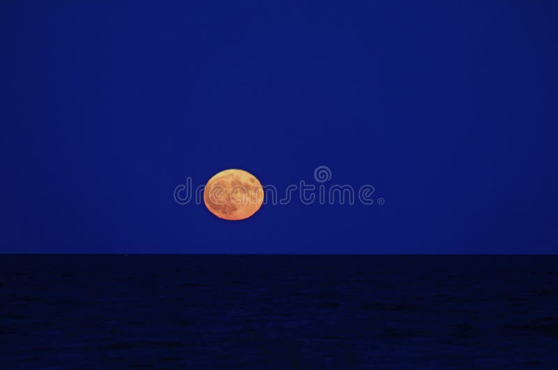 Red Full Moon Over the Calm Sea Stock Photo - Image of surface, scenery ...