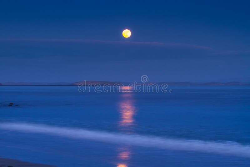 Red Full Moon Reflected in the Atlantic Ocean, Ireland Stock Image ...