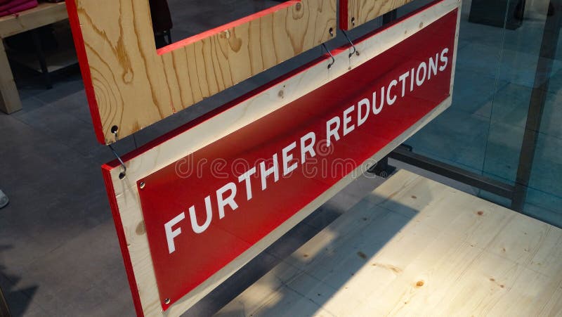 Red Further Reductions Shop Sign Stock Photo - Image of sign ...