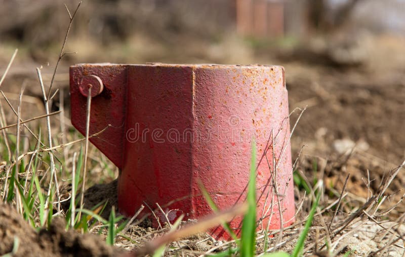 Red gas pipe in the ground stock image. Image of tube - 187090591