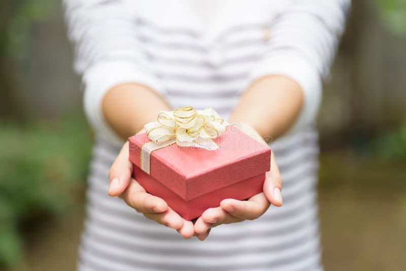 Red Gift Box in Hand for Giving Stock Image - Image of object, outdoor ...