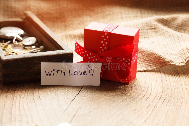 Red Gift Box Tied Red Ribbon, with a Sign Stock Image - Image of ...