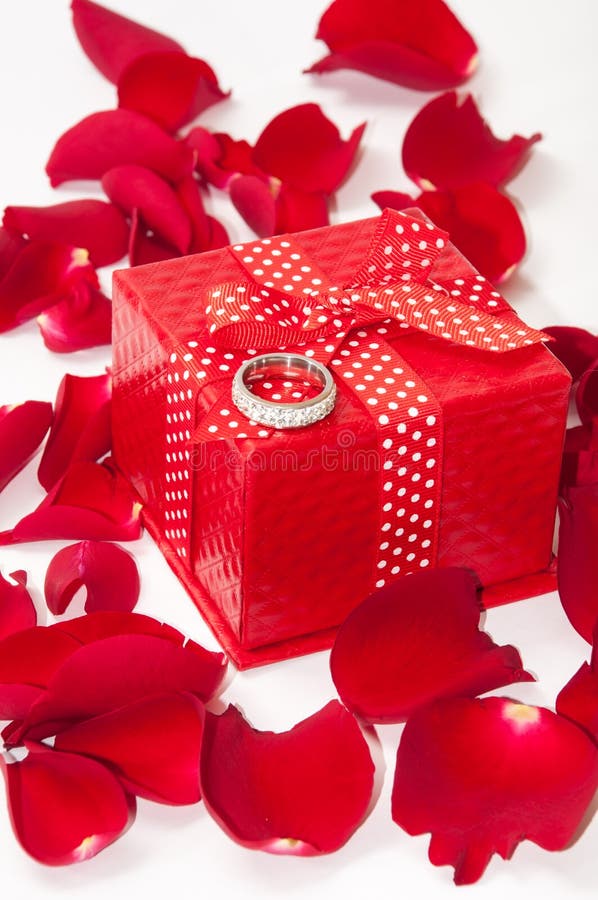 Red Gift Box with Wedding Ring and Red Rose Petals Stock Image - Image ...