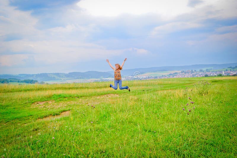 Red girl jumping stock photo. Image of grass, garden - 43391368