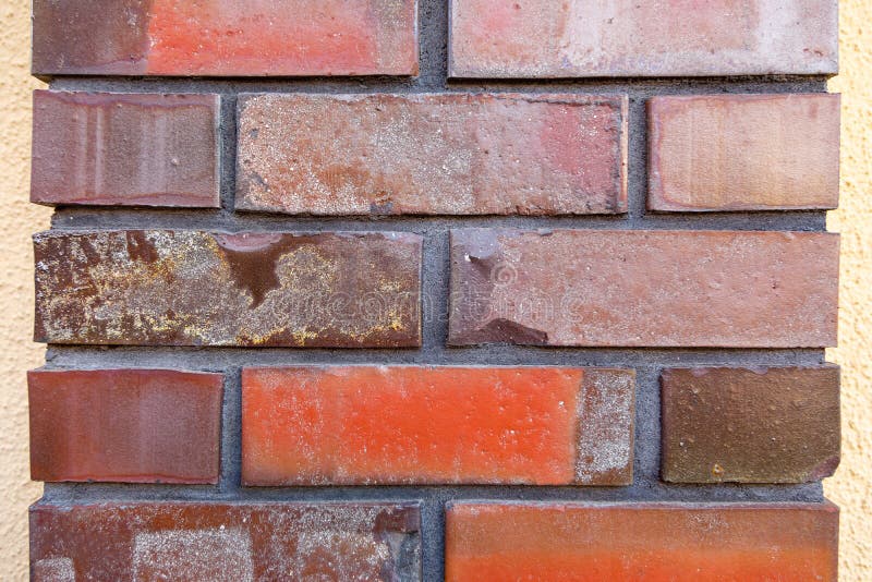 Red Glazed Brick Background. Bricks of Different Shades Close-up Stock ...