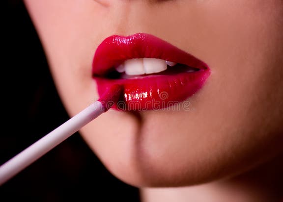 Red gloss lips with brash stock photo. Image of model - 24298392