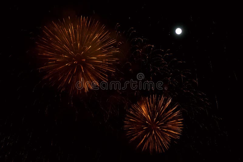 Red and Golden Fireworks at Night Background with Moon Stock Photo ...