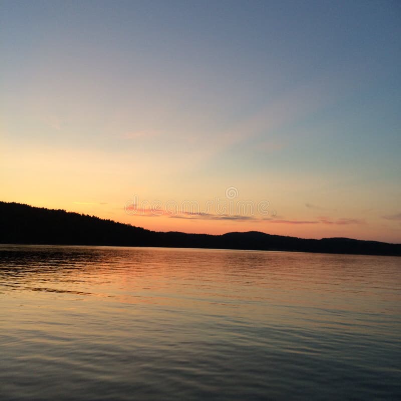 Red and Golden Sunset Over Water Stock Image - Image of ocean, bluesky ...