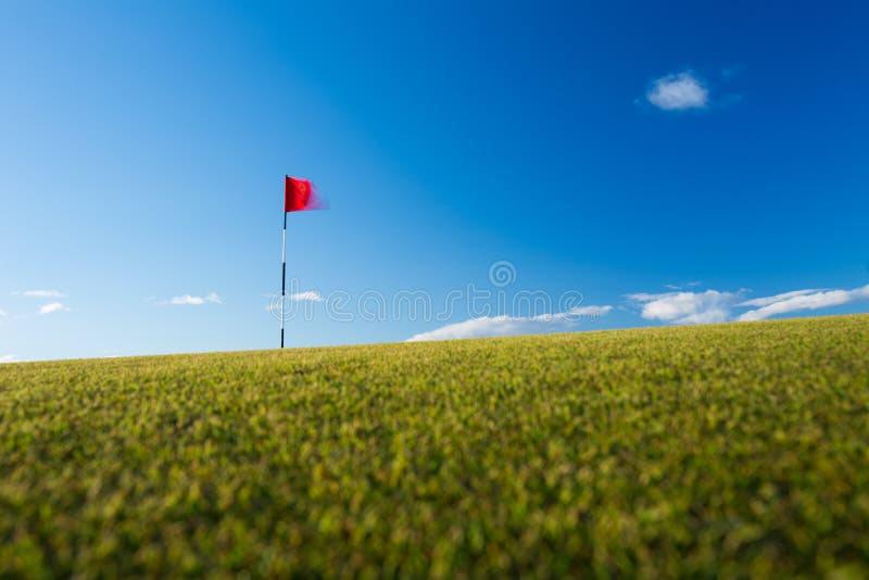 Red Golf Flag on a Golf Course, Moving in the Wind Stock Image - Image ...