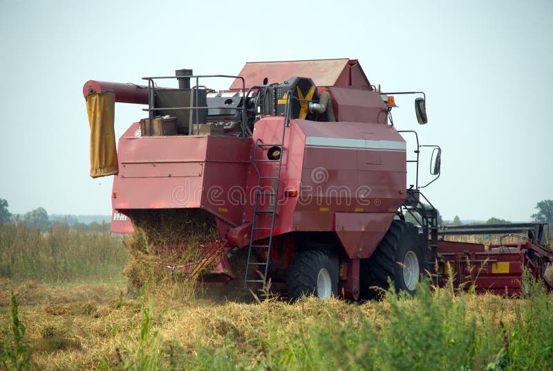 Combine Harvester Loading Grain into a Trailer Stock Image - Image of ...