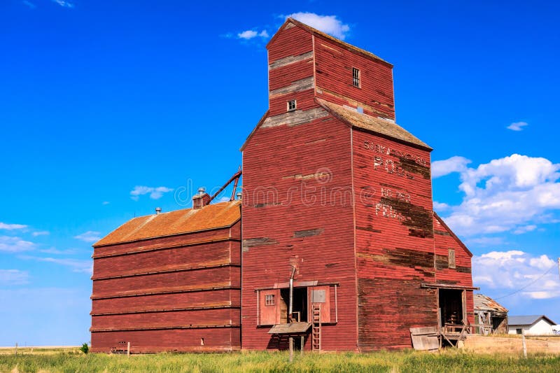 A Red Grain Silo with a Blue Sky in the Background Stock Image - Image ...