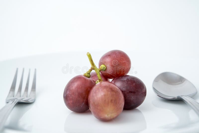 Red grape on white plate stock photo. Image of eating - 125830814