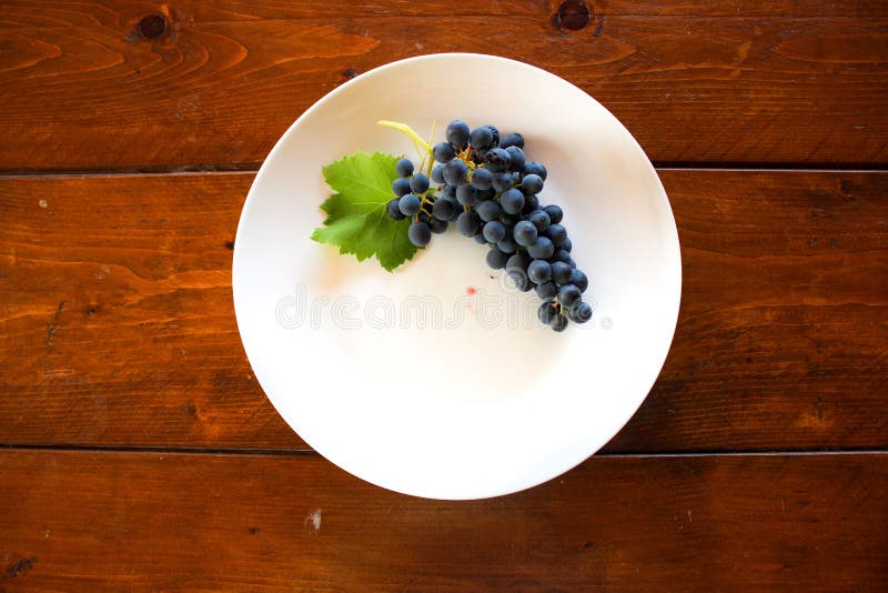 Red grape on the plate stock image. Image of harvest - 125869183