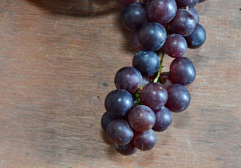 Red grape on wood table stock photo. Image of vitamin - 55093692