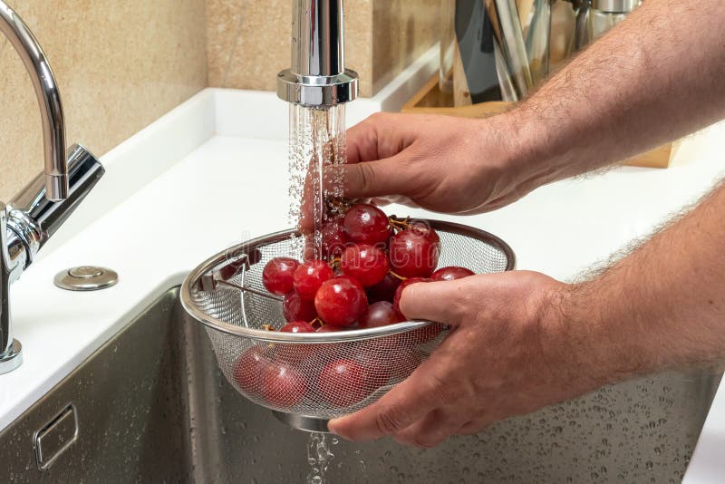 Red Grapes in a Modern Kitchen Under Running Water Stock Photo - Image ...