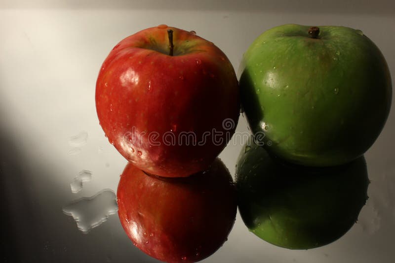 Apple in the mirror image stock photo. Image of brainchild - 36692732