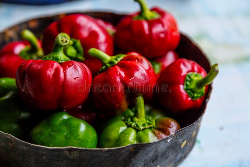 Red and Green Capsicum on a Old Table. Stock Photo - Image of orange ...