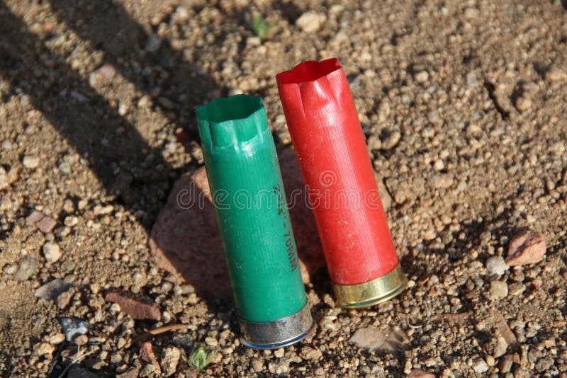 Red and Green Shotgun Shells Stock Photo - Image of cartridge, soil ...