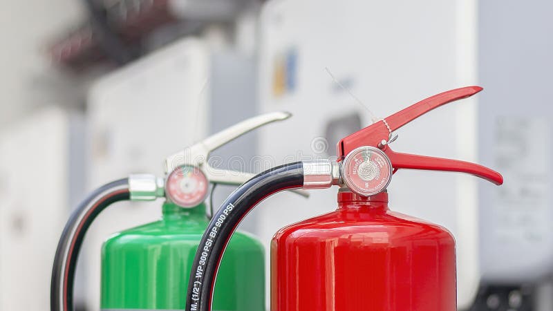 Red and Green Fire Extinguisher Installed in Factory Stock Photo ...